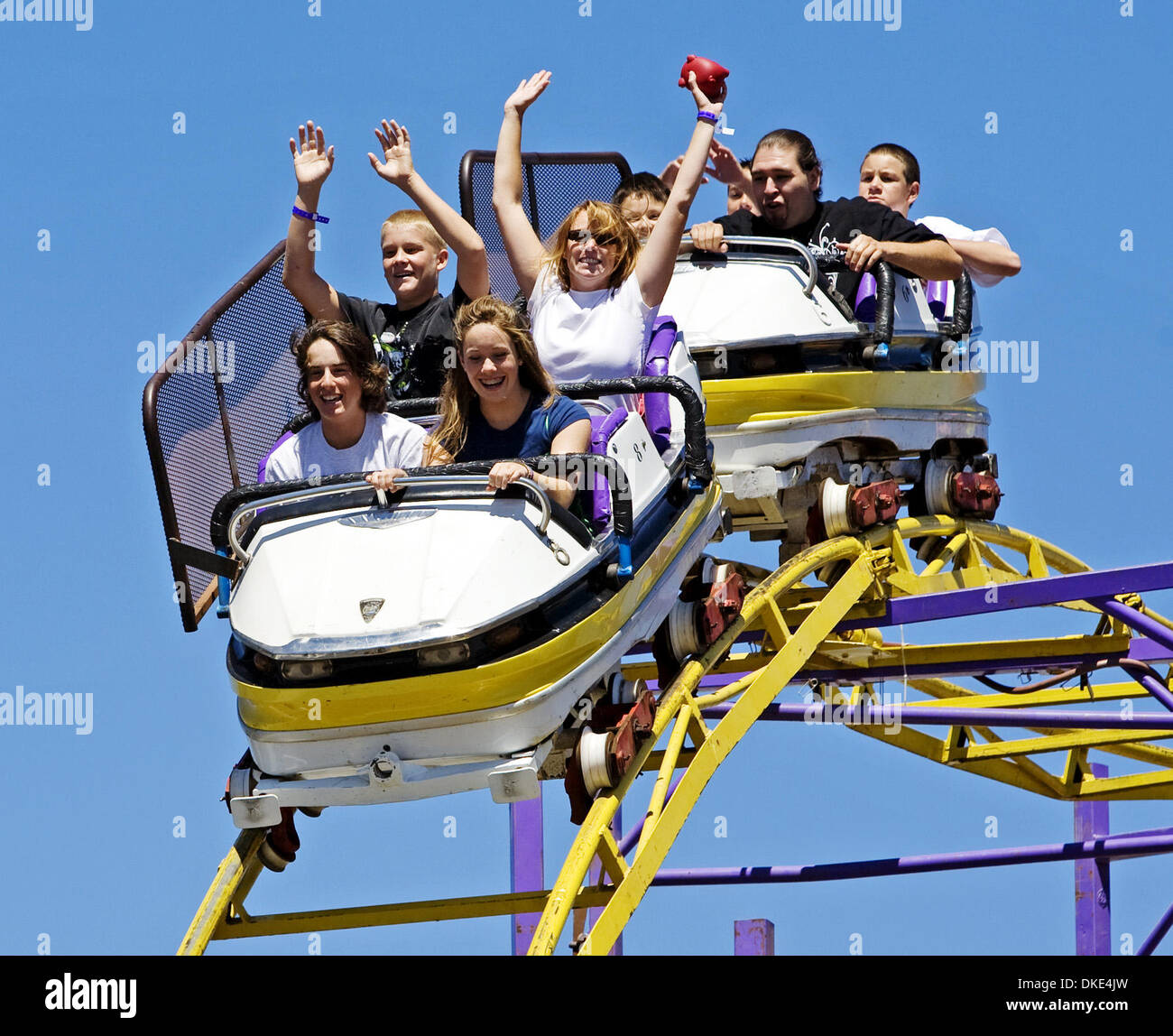 People enjoy the roller coaster ride at the San Mateo County Fair ...