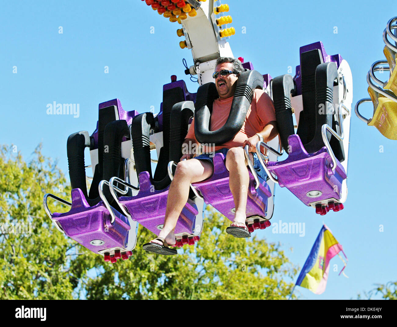 Joe Santiago, 50, from Mt. View, rides the Spin Out ride , at the San ...