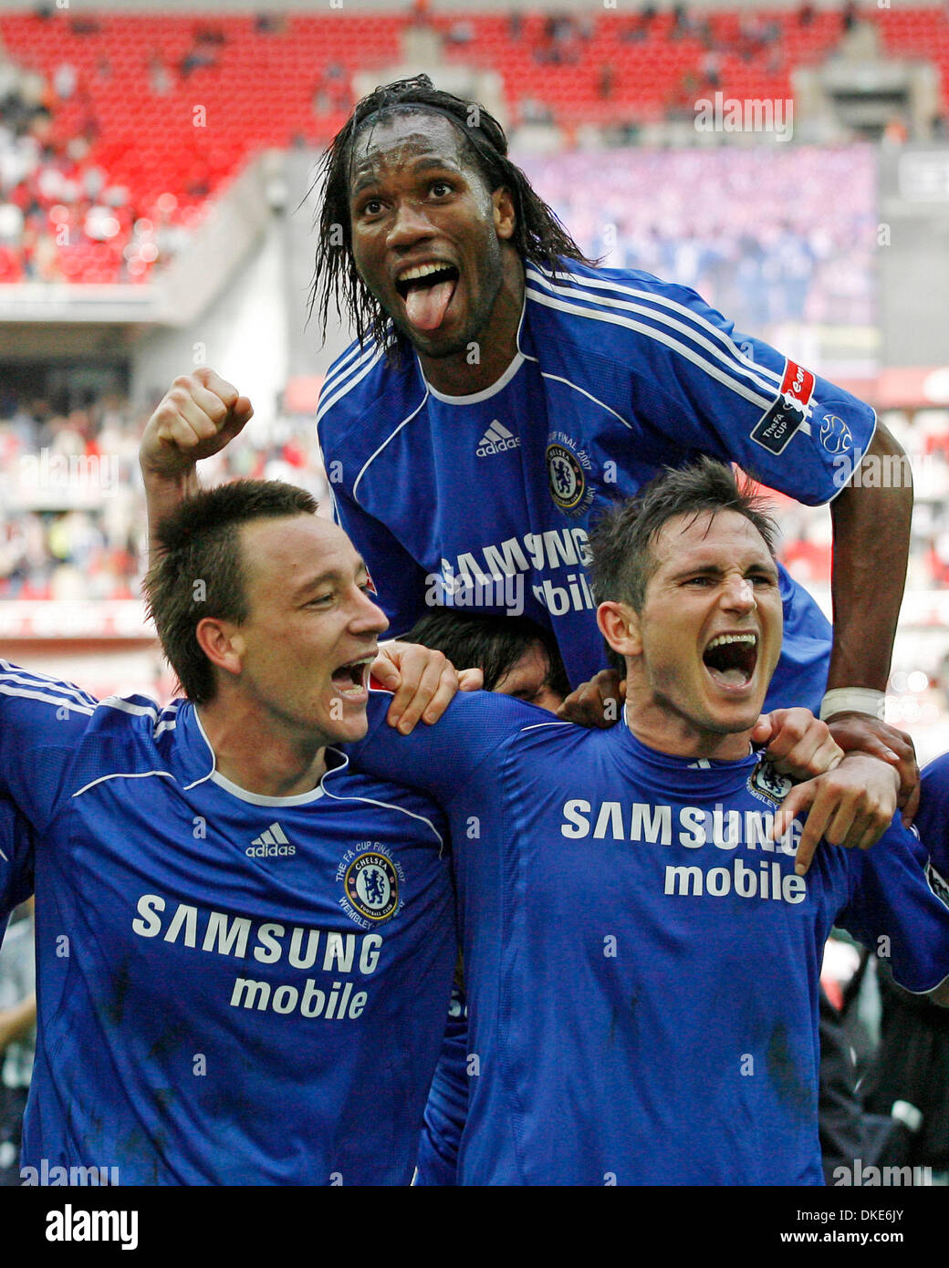 Chelsea's Didier Drogba (top) celebrates victory with his teammates ...