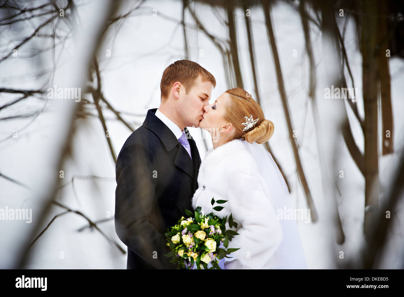 Couple kiss in snow in hi-res stock photography and images - Alamy