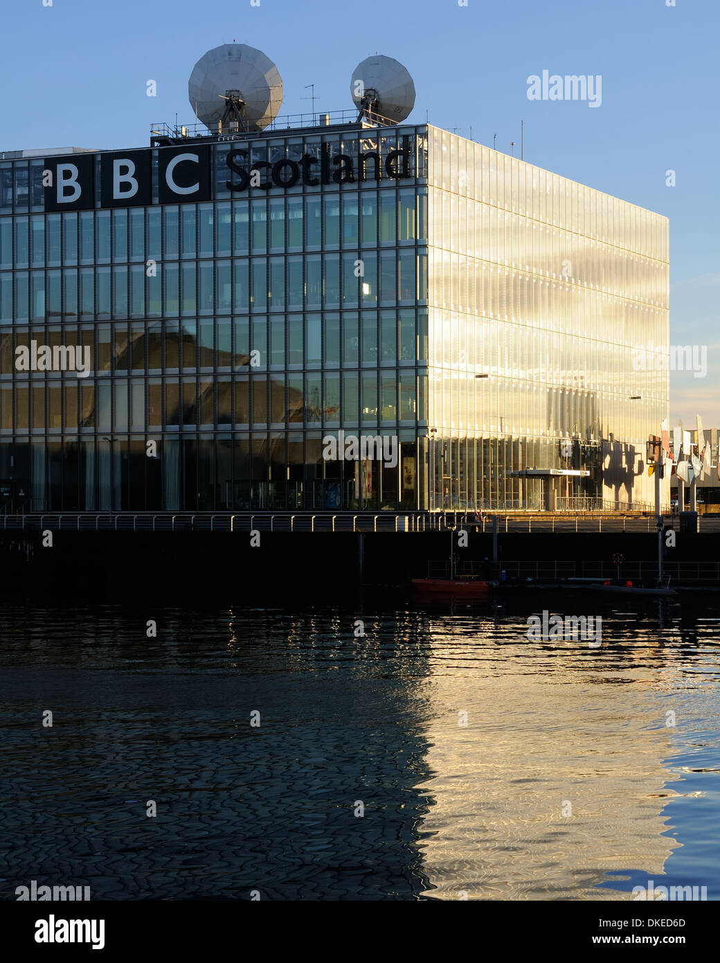 BBC Scotland studios in strong sunlight and shadow with reflection on ...