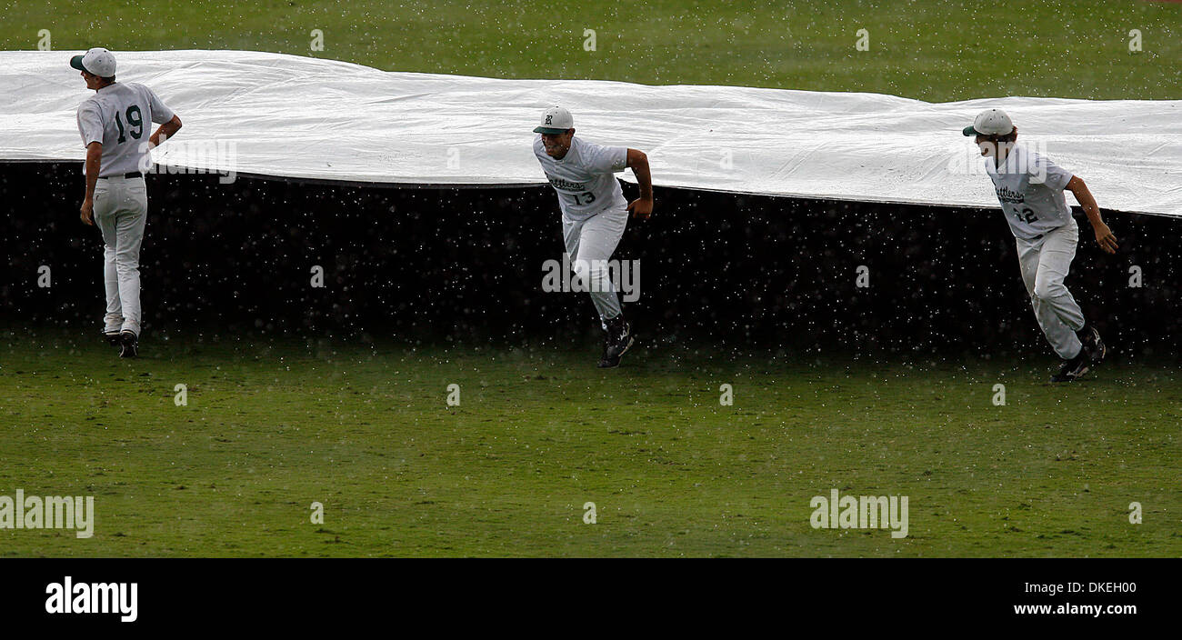 Reagan baseball players Austin Hays (19), Justin Ortega (13) and Eric ...