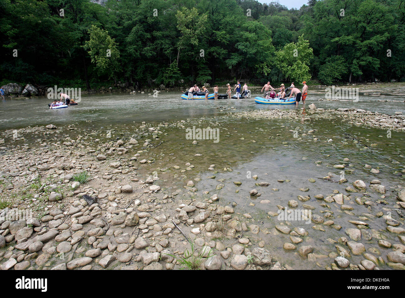 METRO Tubers and boaters negotiate a low water level near the third ...