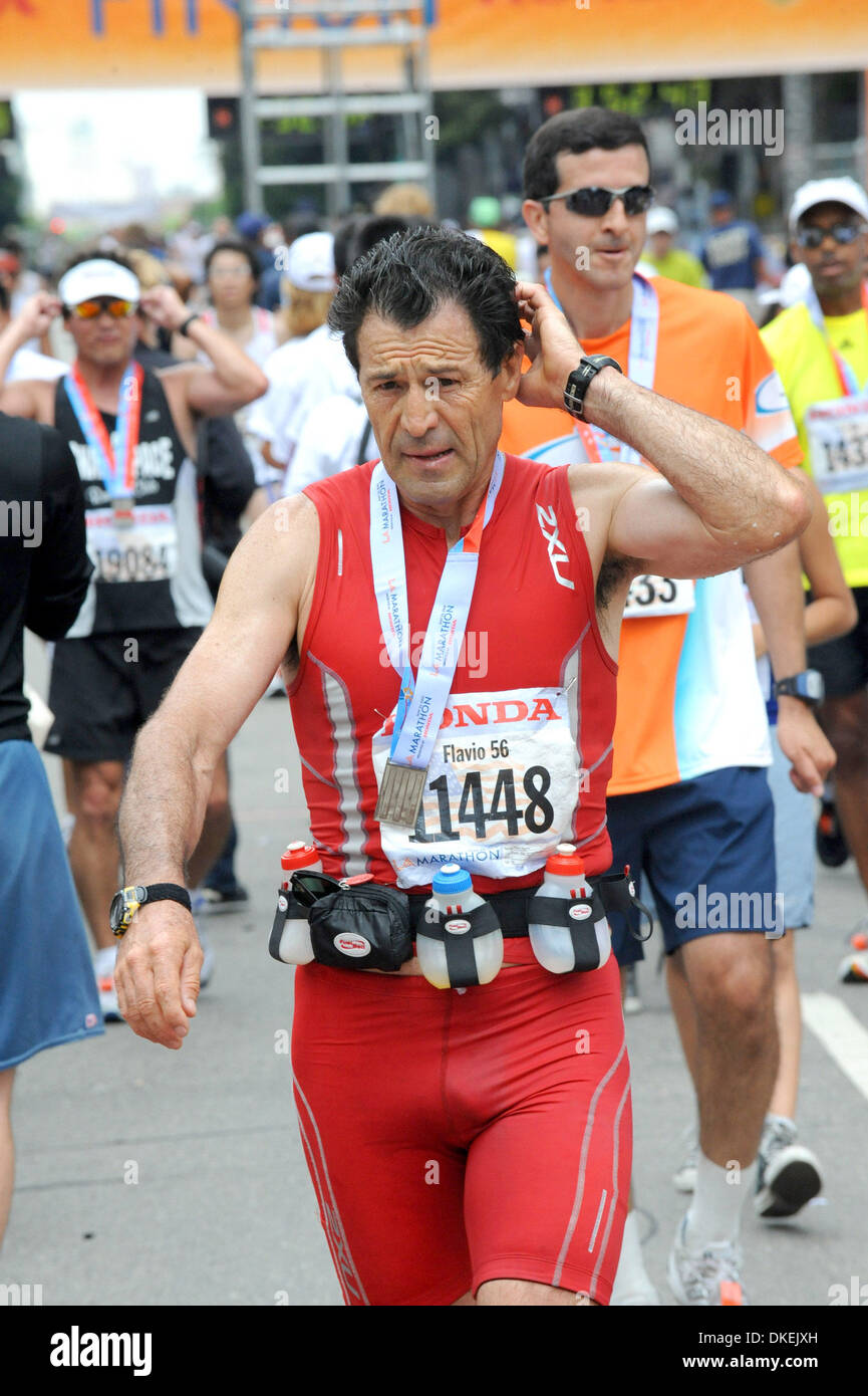 Runners pass finish line hi-res stock photography and images - Alamy