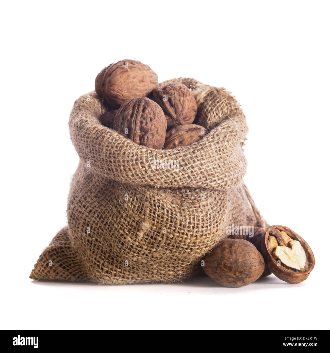 Walnuts in burlap bag isolated on white Stock Photo - Alamy