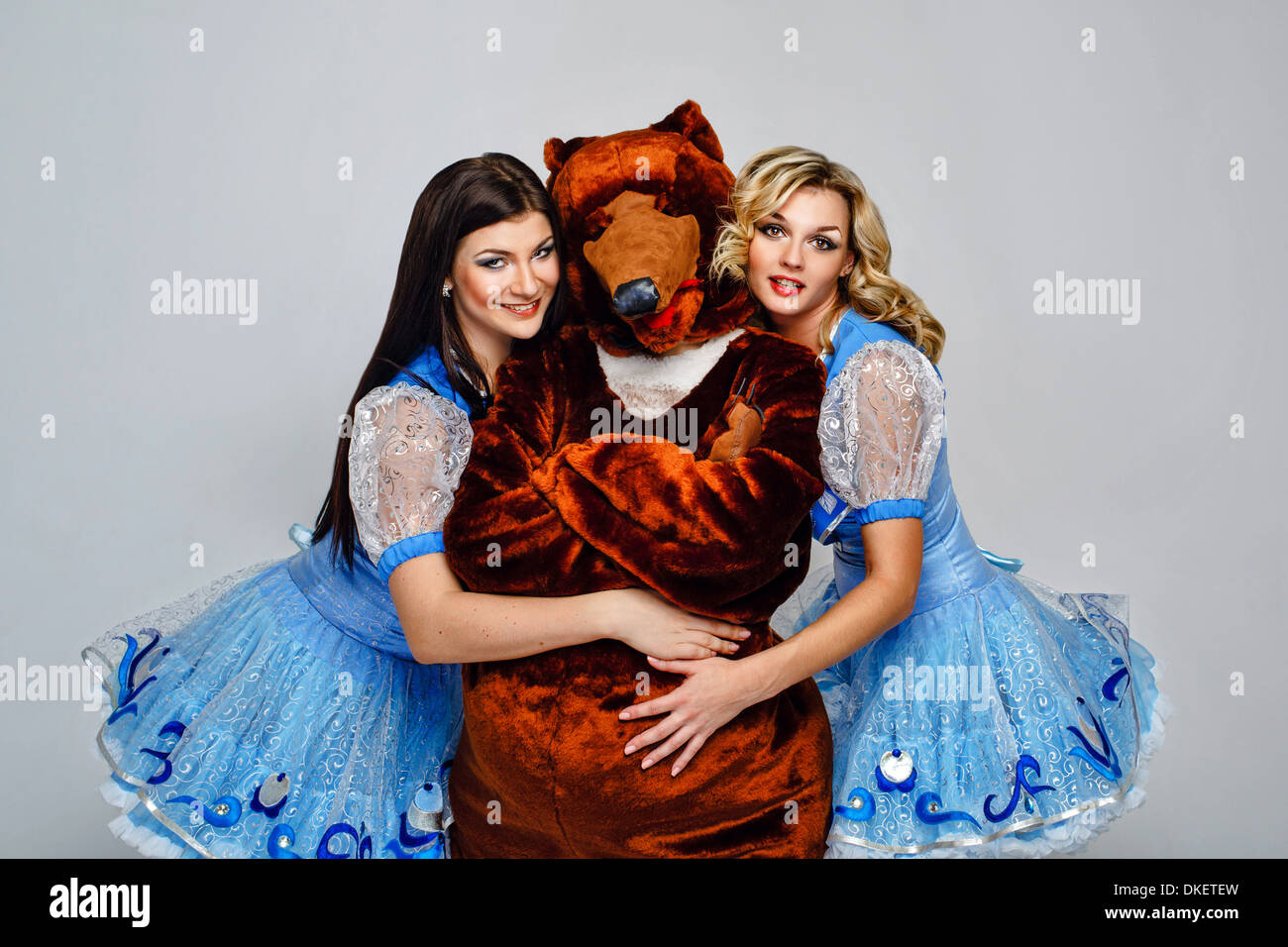 Attractive young girl hugging bear puppets Stock Photo - Alamy
