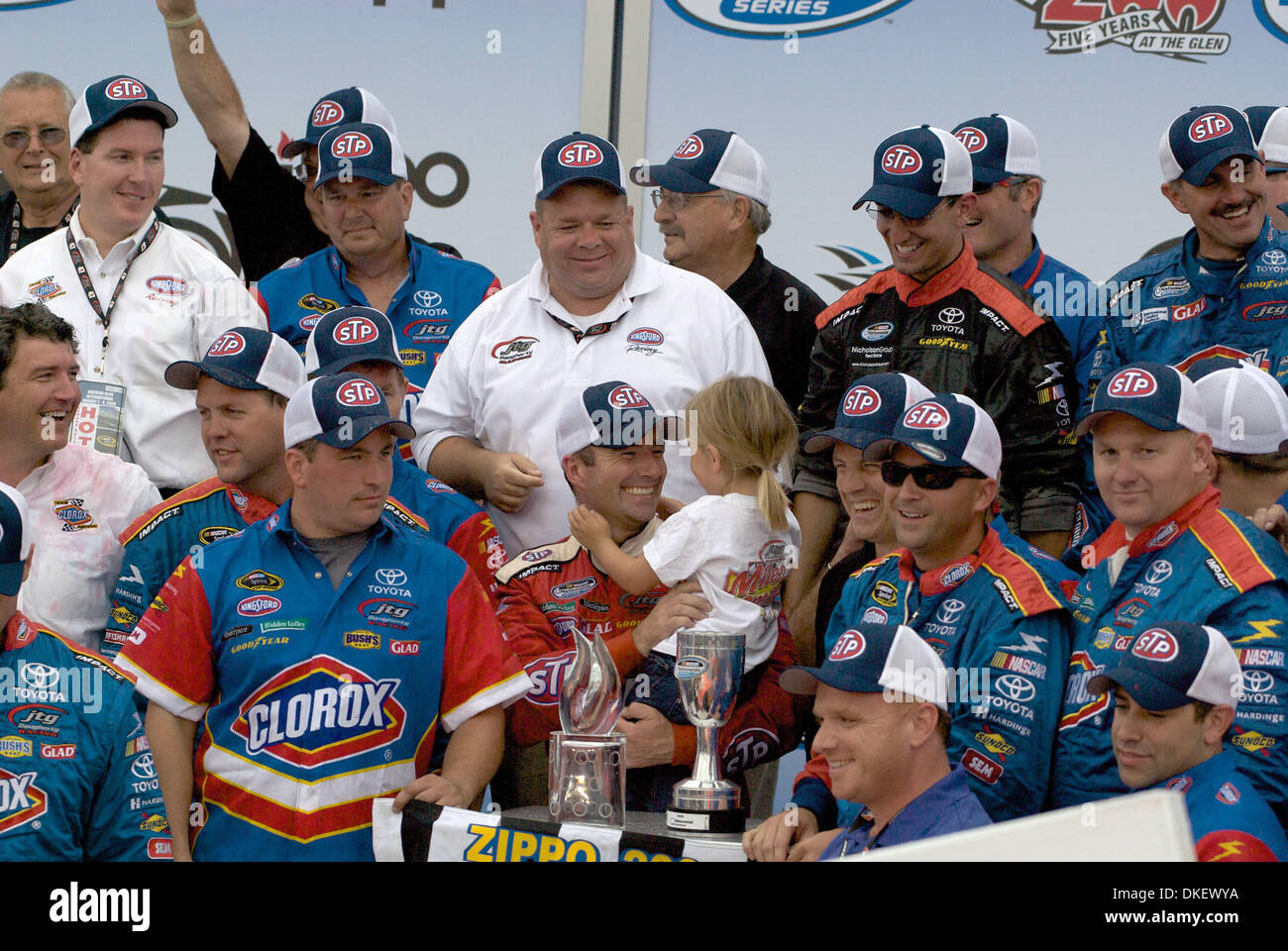 08 August 2009: Marcos Ambrose gives a smile to his daughter after ...
