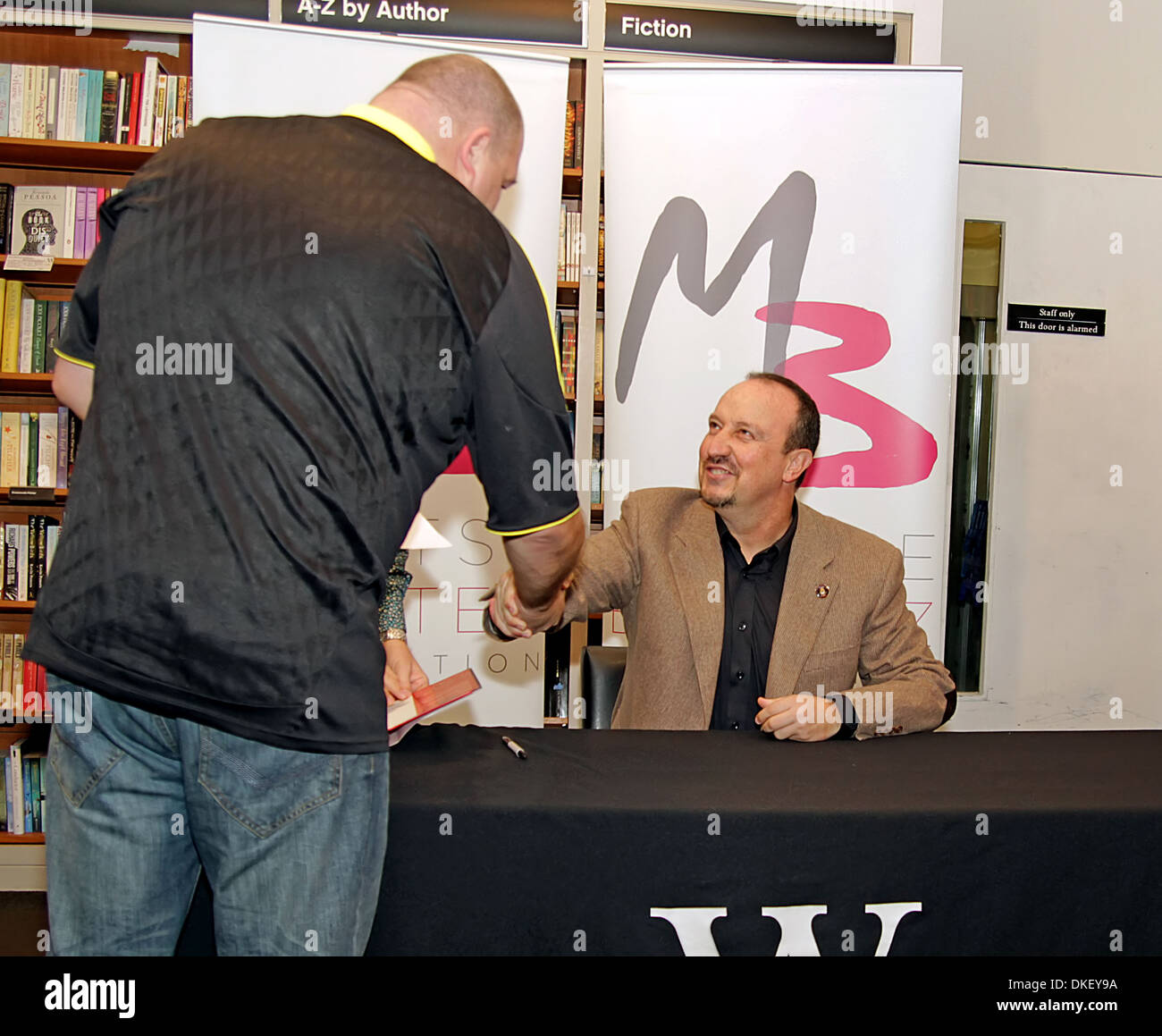 Former Liverpool FC manager Rafa Benitez meets a fan as he signs copies ...