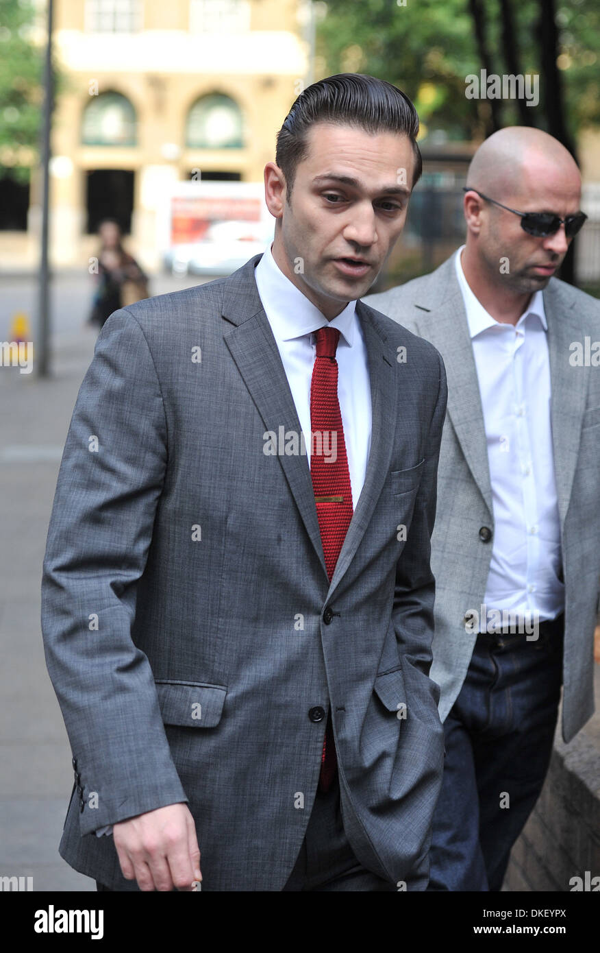 Reg Traviss appears in court on two counts of rape at a trial held at ...