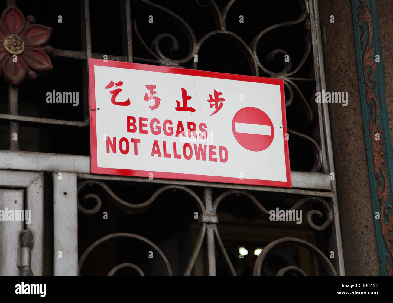 It's a photo of street board sign with the mention "Beggars Not Allowed ...