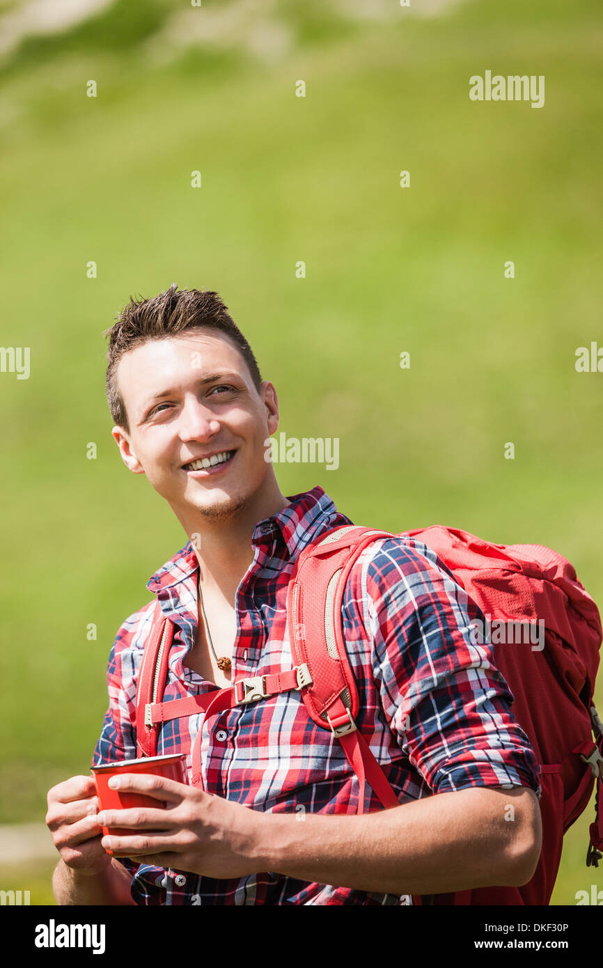 Portrait of smiling man with backpack hi-res stock photography and ...