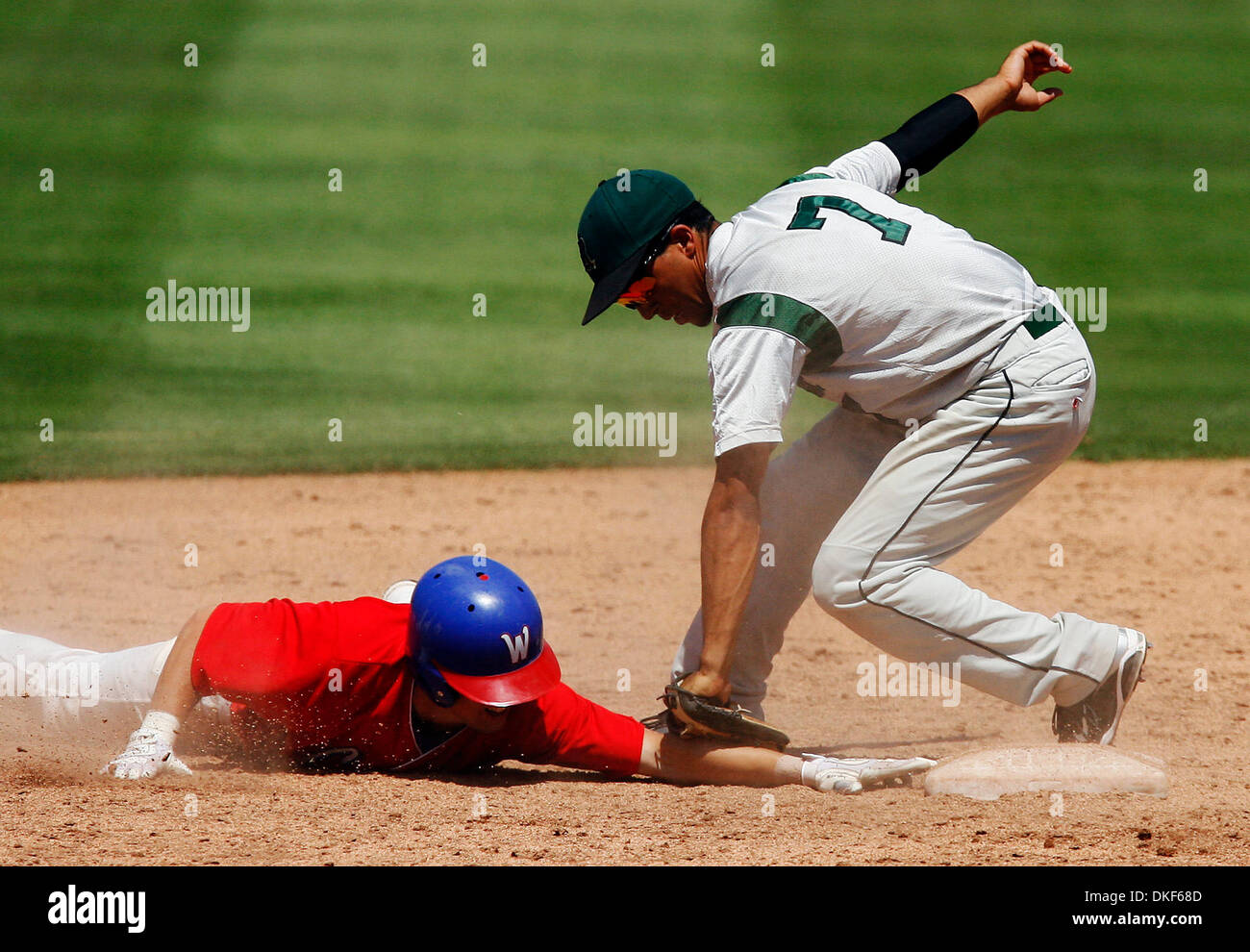 Reagan's Derrick Walls (right) just misses a tag at second on Austin ...