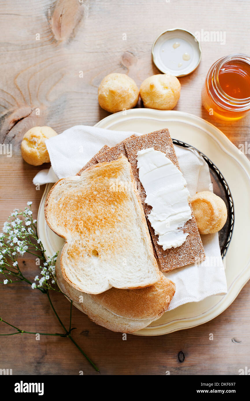 Bread, puffs and honey Stock Photo - Alamy