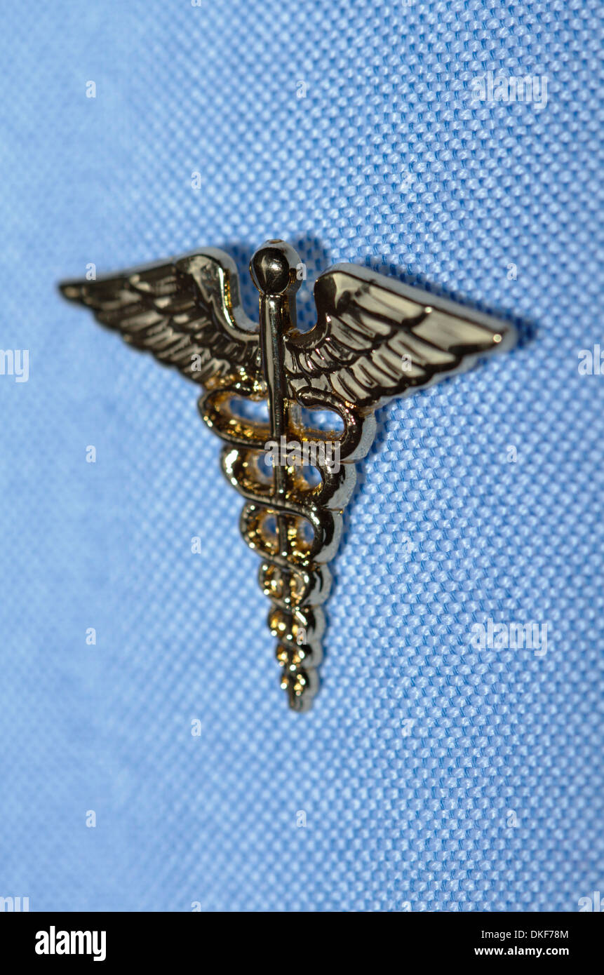 Caduceus pin attached to a shirt Stock Photo - Alamy