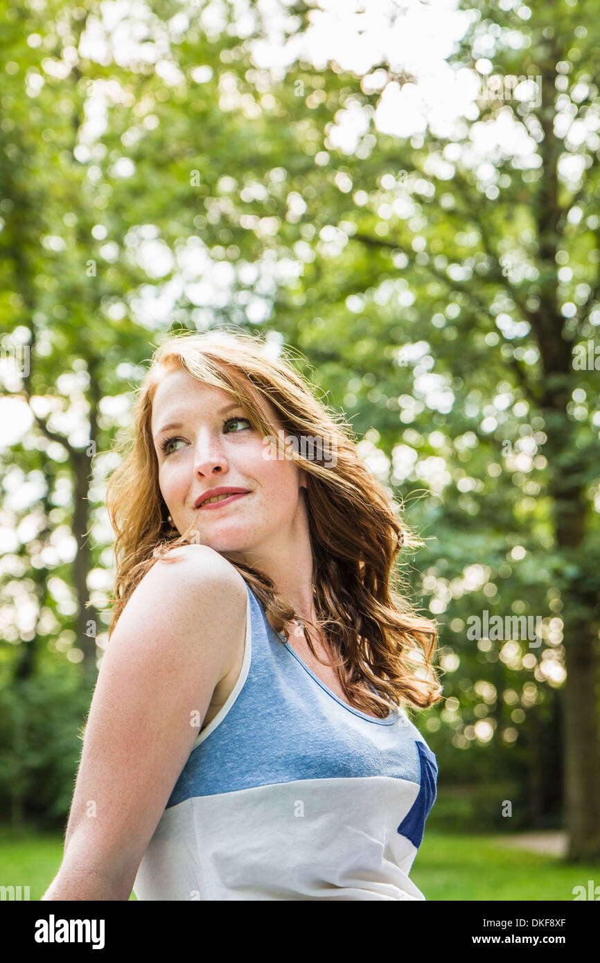 Young woman in red vest hi-res stock photography and images - Alamy