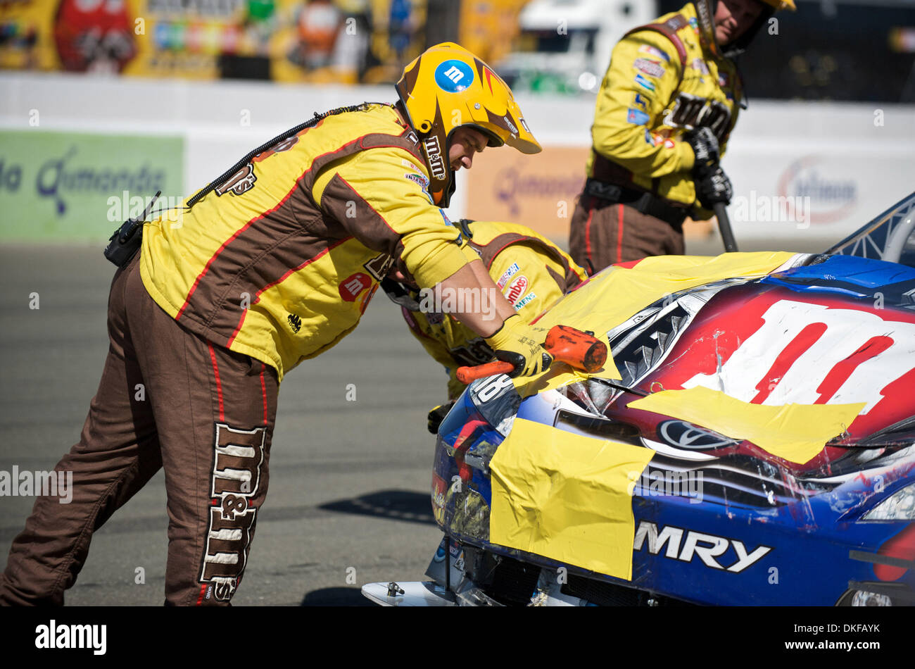 Jun 21, 2009 - Sonoma, California, USA - The pit crew works on the #18 ...