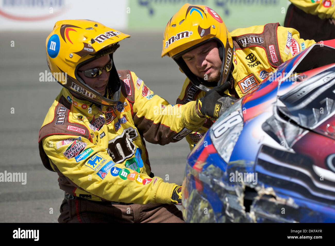 Jun 21, 2009 - Sonoma, California, USA - The pit crew works on the #18 ...