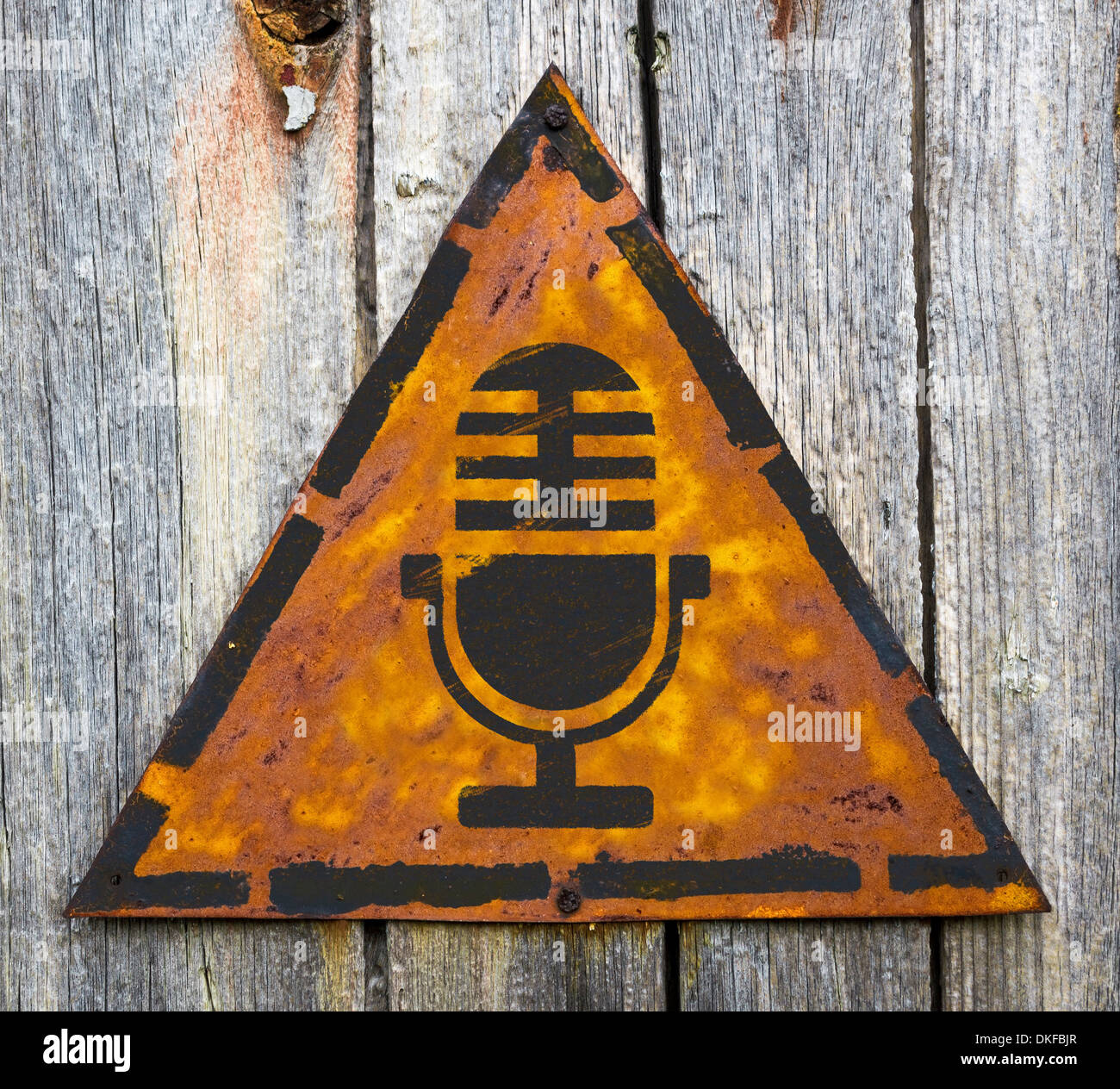 Microphone Icon on Rusty Warning Sign Stock Photo - Alamy