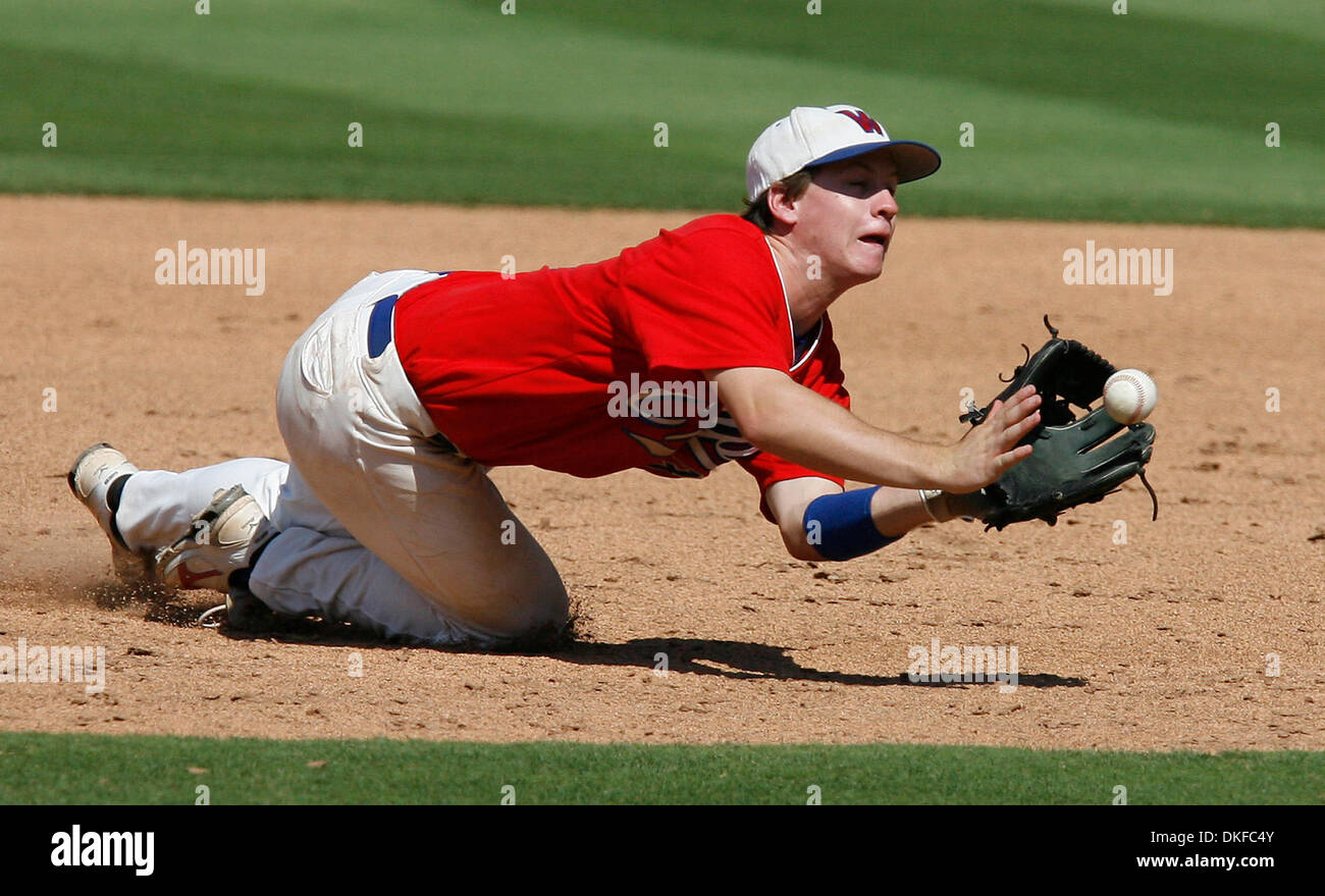 Austin Westlake's Michael Perkins dives for a grounder during their ...