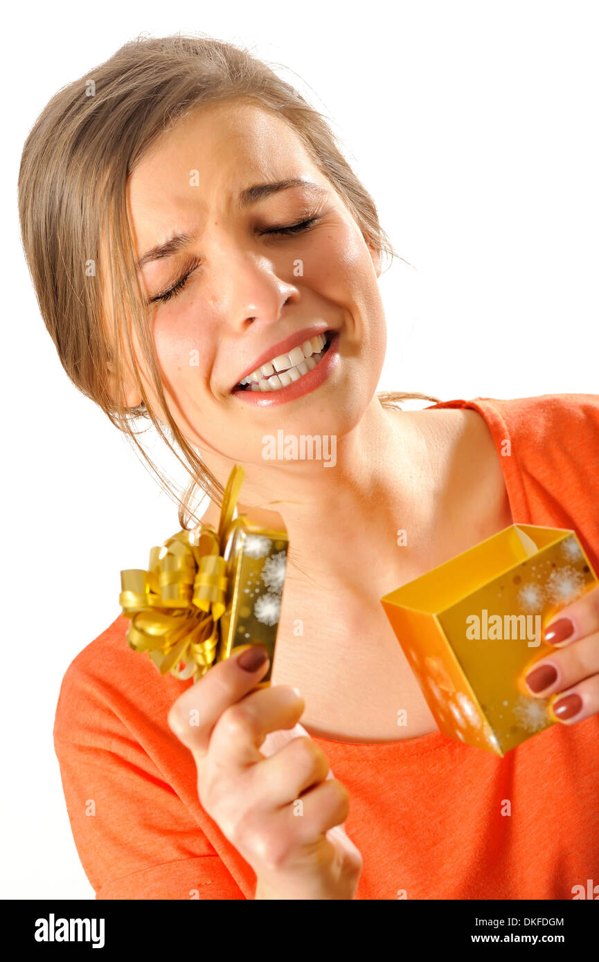 reaction of a girl when open a gift box isolated over white background ...