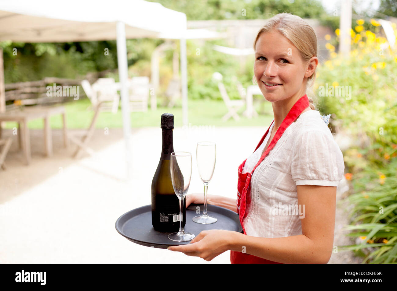 Waiter holding tray wine glasses hi-res stock photography and images ...