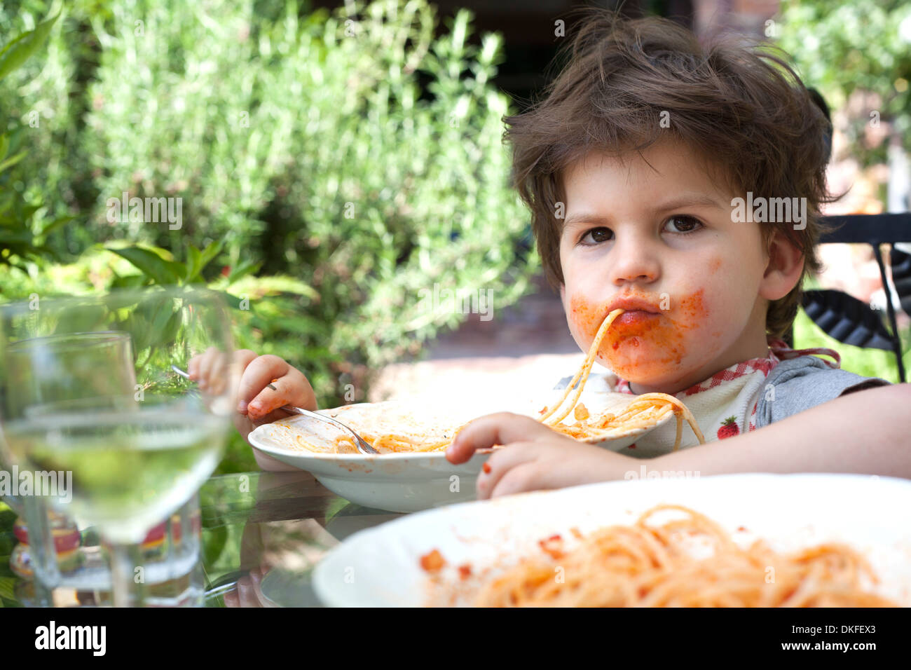 Portrait messy boy eating spaghetti hi-res stock photography and images ...