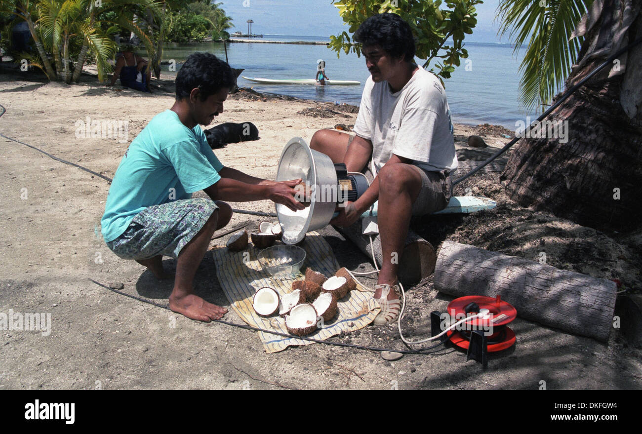 Tahiti. Coconut pulp production on a sandy beach Stock Photo - Alamy