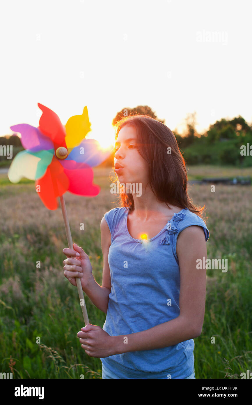 Kid girl blowing windmill hi-res stock photography and images - Alamy
