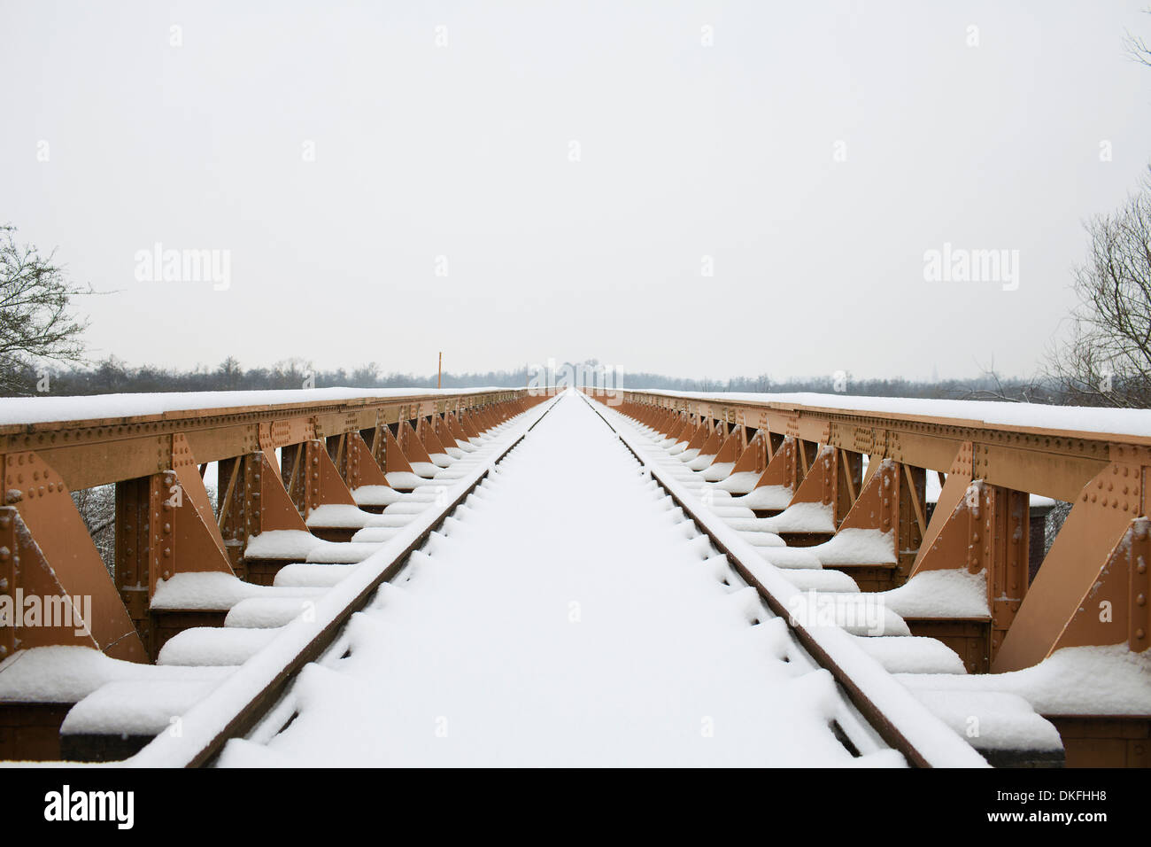 Railway track and bridge in winter snow Stock Photo - Alamy