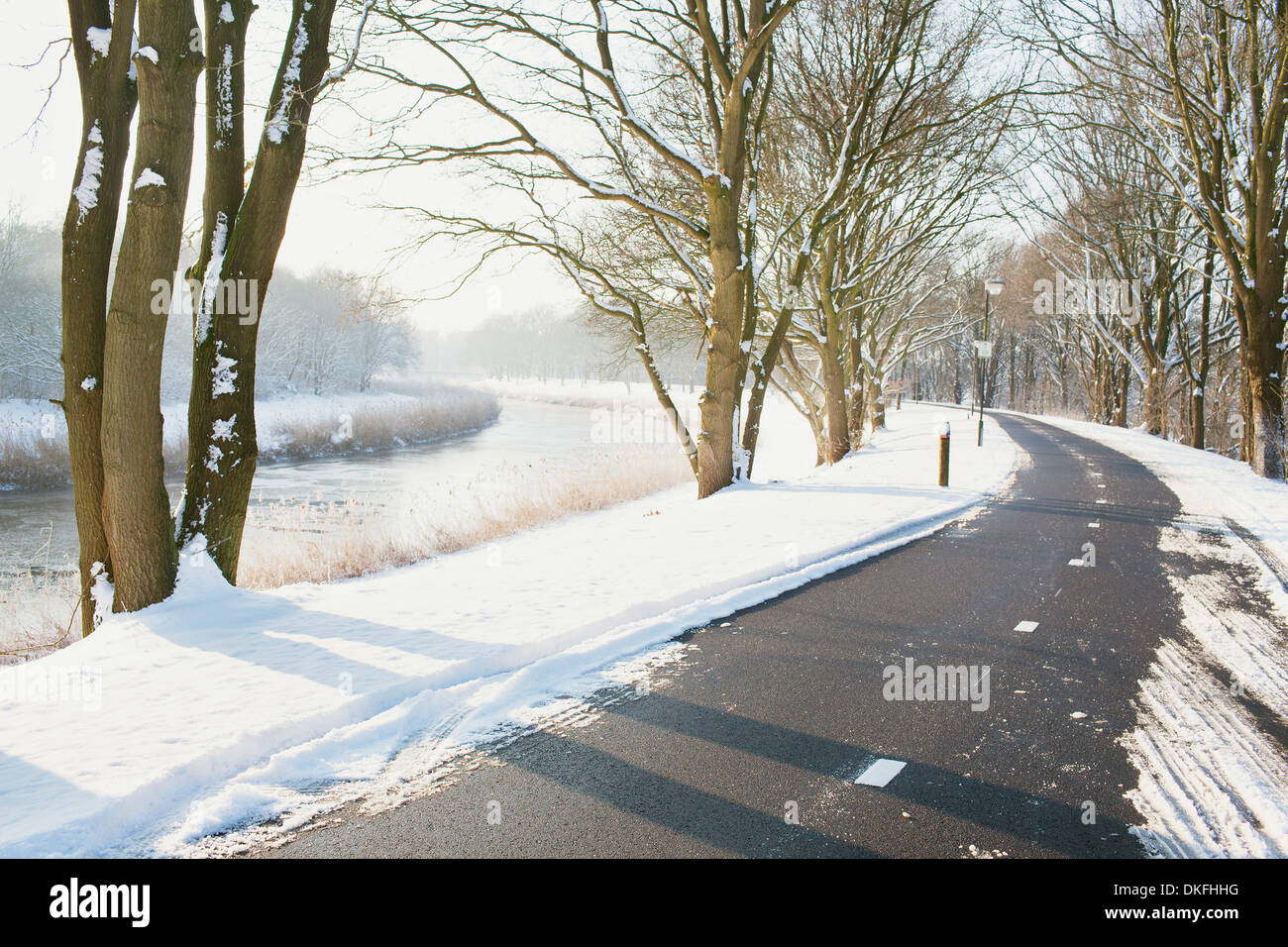 Rural road cleared of snow in winter Stock Photo - Alamy