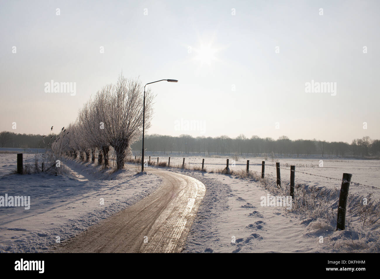 Rural icy road cleared of snow in winter Stock Photo - Alamy