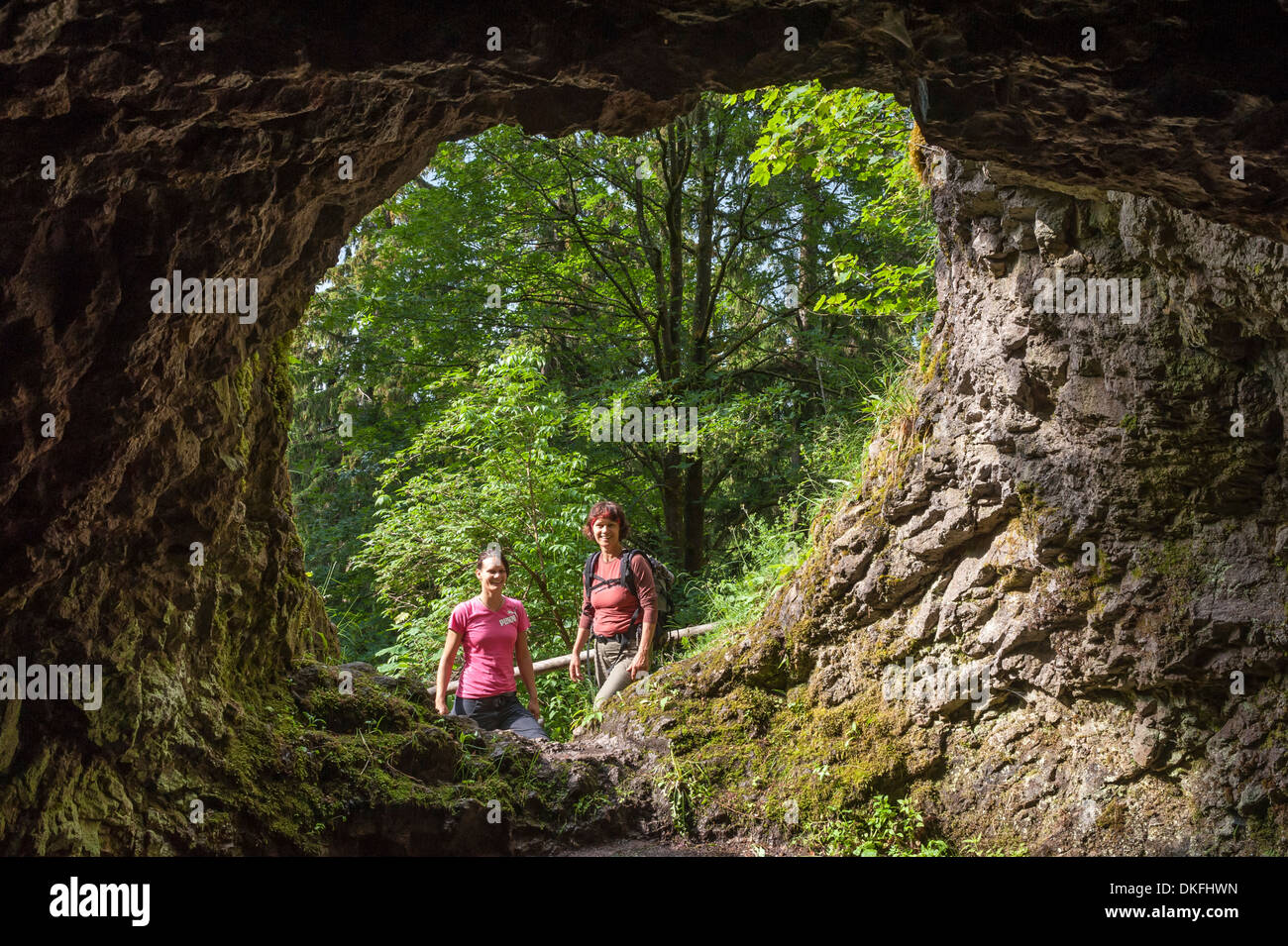 Female hikers in front of the cave at Großer Hermannstein rock ...