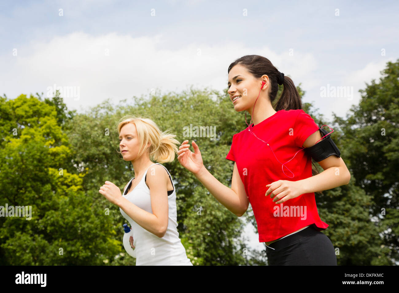 Women jogging through park Stock Photo - Alamy