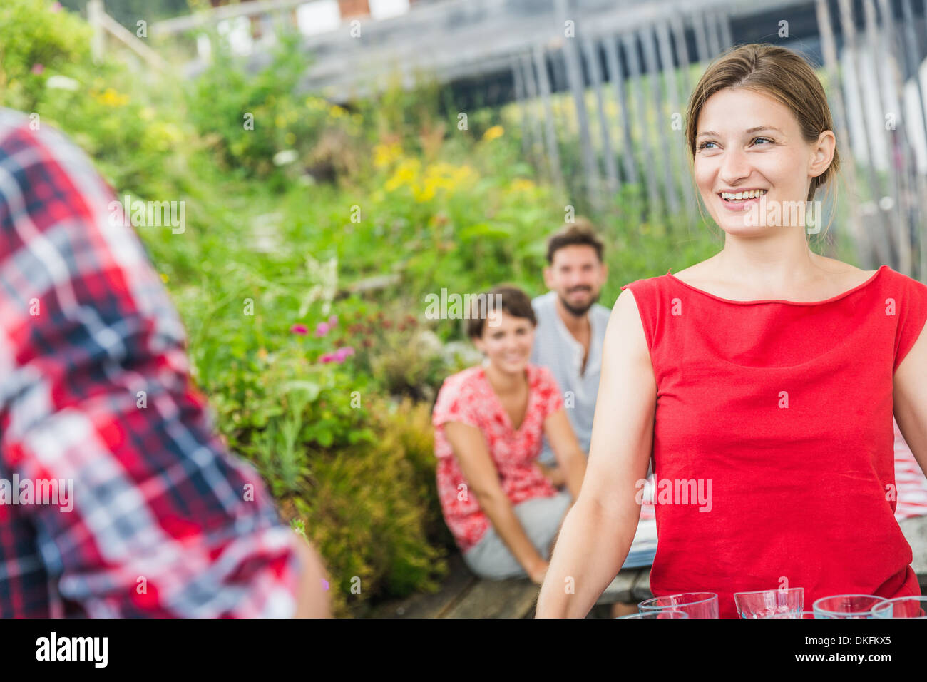 Smiling waitress serving meal hi-res stock photography and images - Alamy