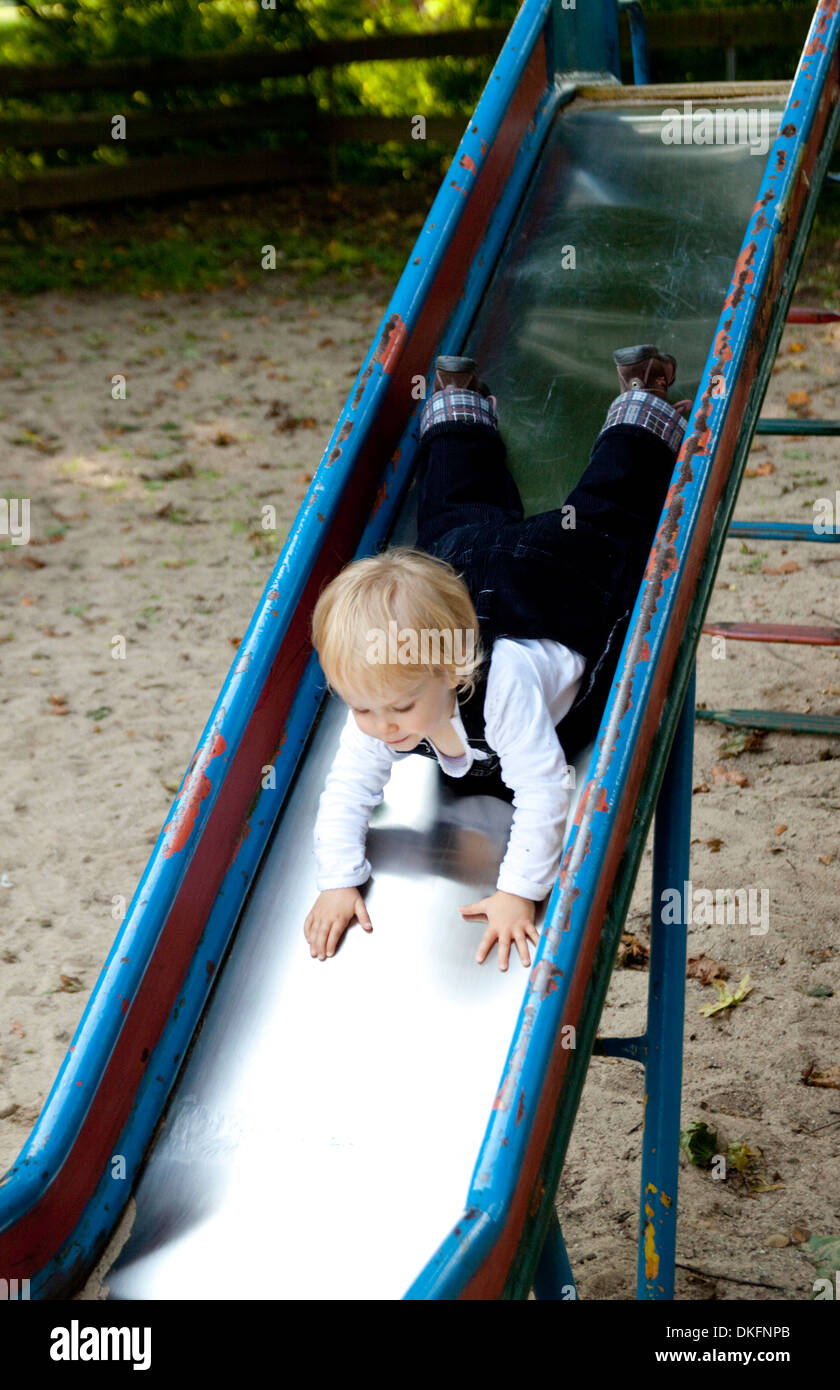 Toddler on a slide Stock Photo - Alamy