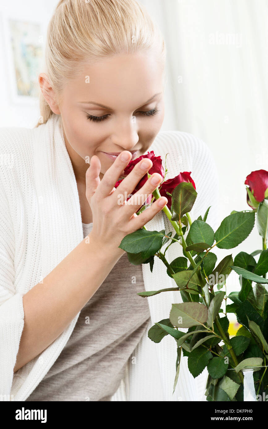 Woman smelling roses hi-res stock photography and images - Alamy