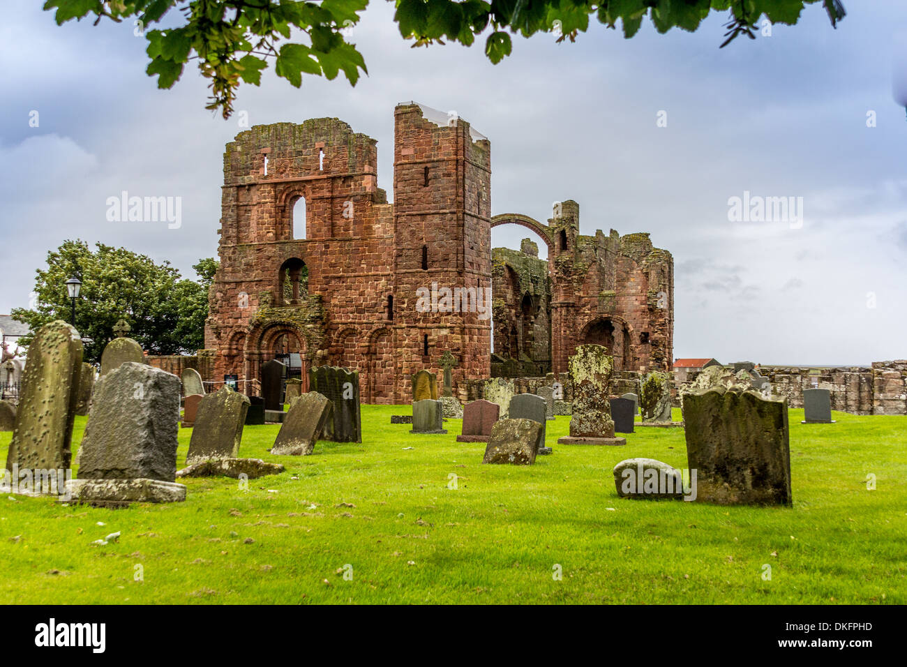 Lindisfarne at Holy Island derelict stone monastery with grave stones ...