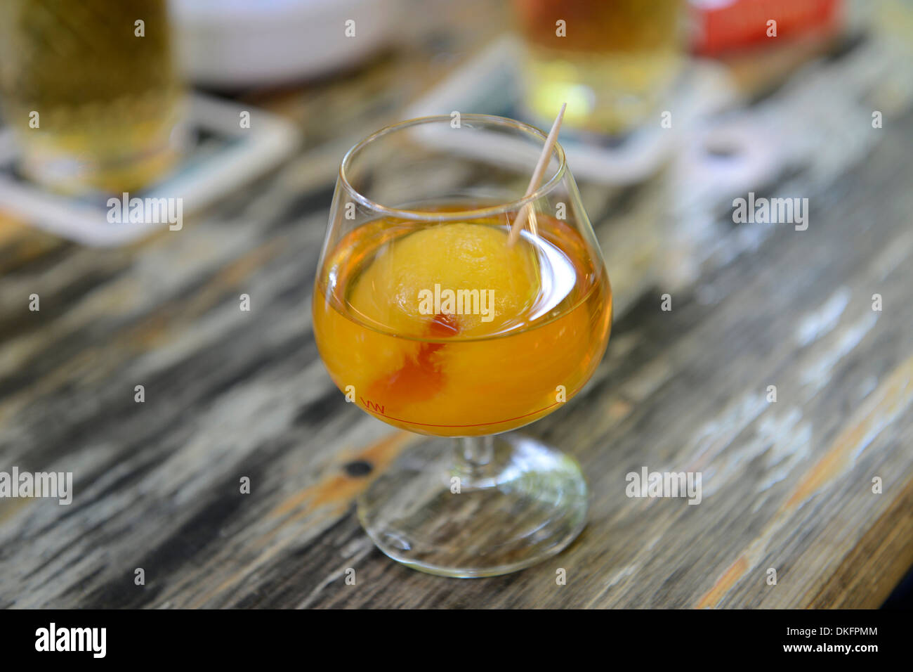 Apricot liquor in snifer Stock Photo - Alamy