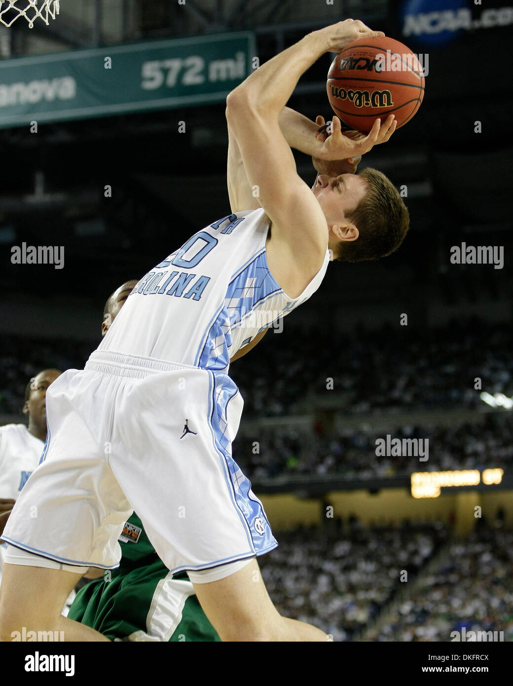 Tyler Hansbrough got fouled hard by Delvon Roe,10, as North Carolina ...