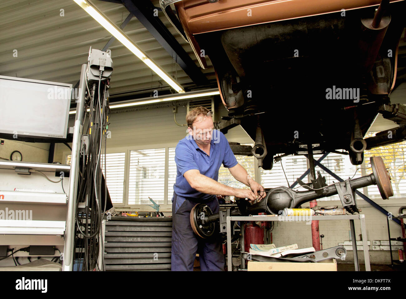 Male mechanic leaning engine hi-res stock photography and images - Alamy