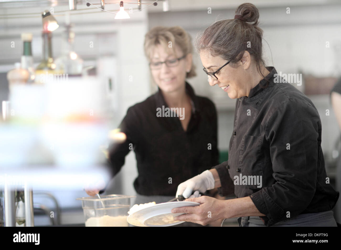 Women working in restaurant kitchen Stock Photo - Alamy