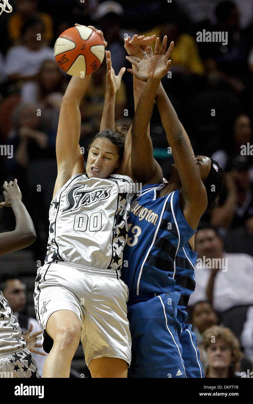 Silver Stars' Ruth Riley (00) competes for a rebound against the ...