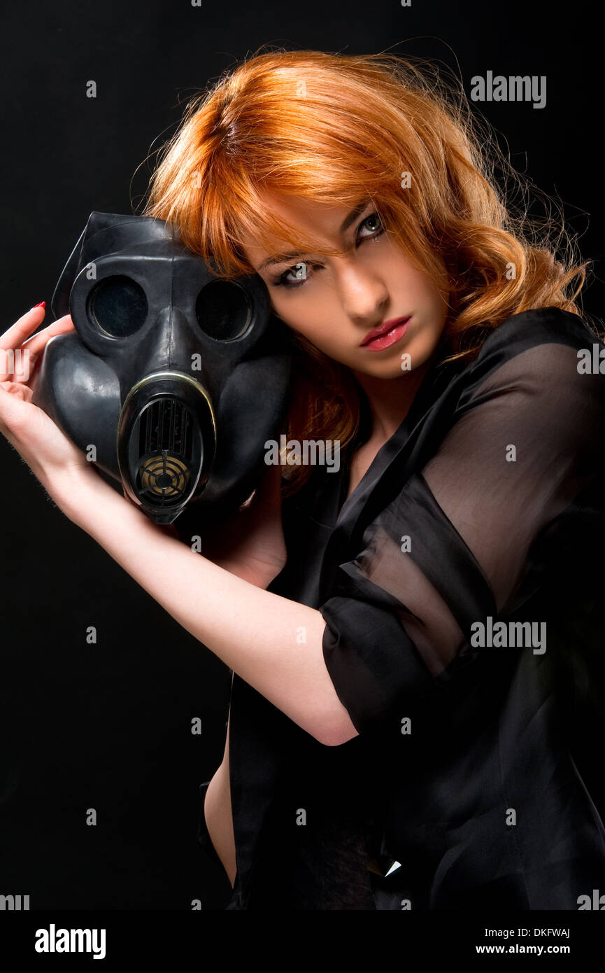 Woman holding gas mask hi-res stock photography and images - Alamy
