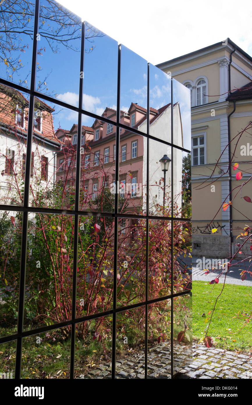 reflection of an historic front in a modern glass facade, weimar city ...