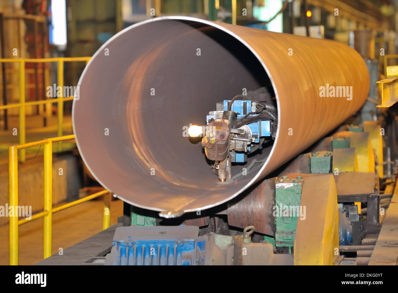 industrial machine for making steel pipes inside of factory Stock Photo ...