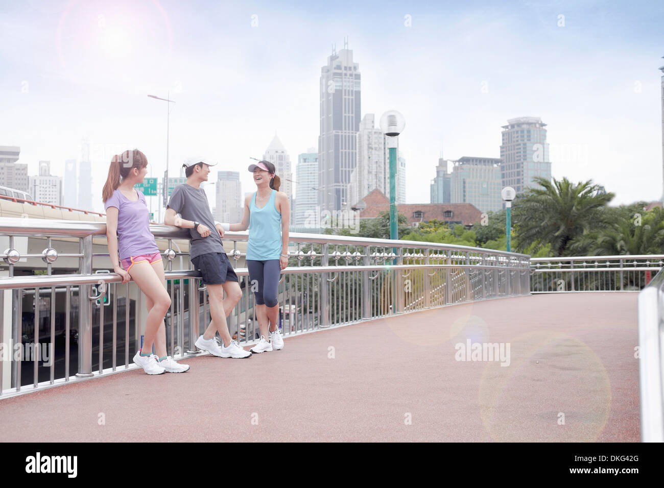 Friends taking a break from running in Shanghai, China Stock Photo - Alamy