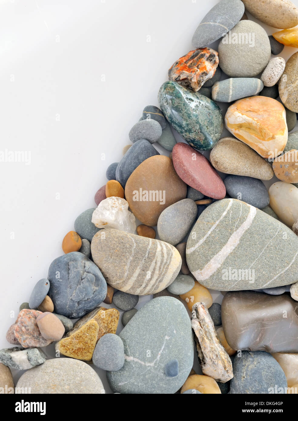 colored stones on white background Stock Photo - Alamy