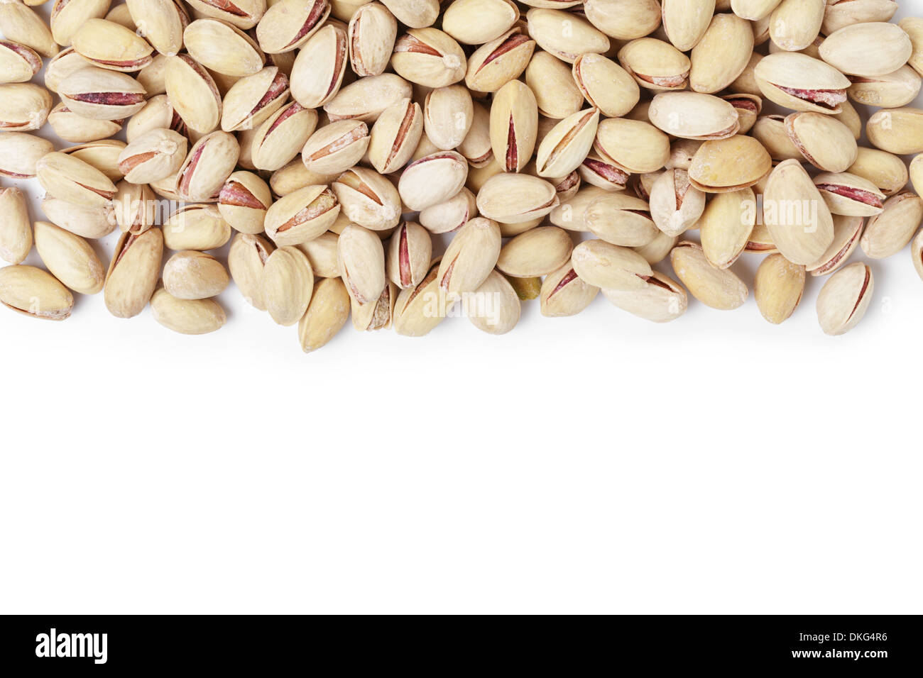 border from roasted salty pistachios nuts, isolated on white background ...