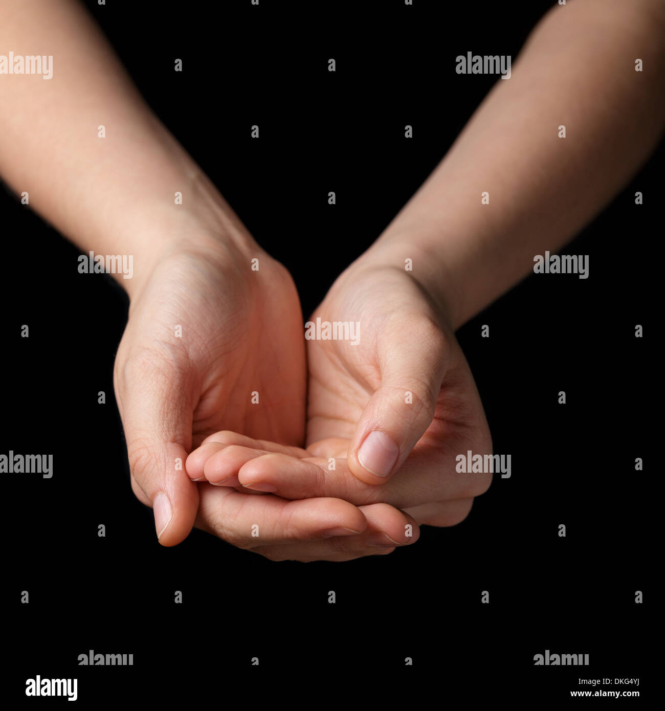 female teen hands begging for something, isolated on black Stock Photo ...