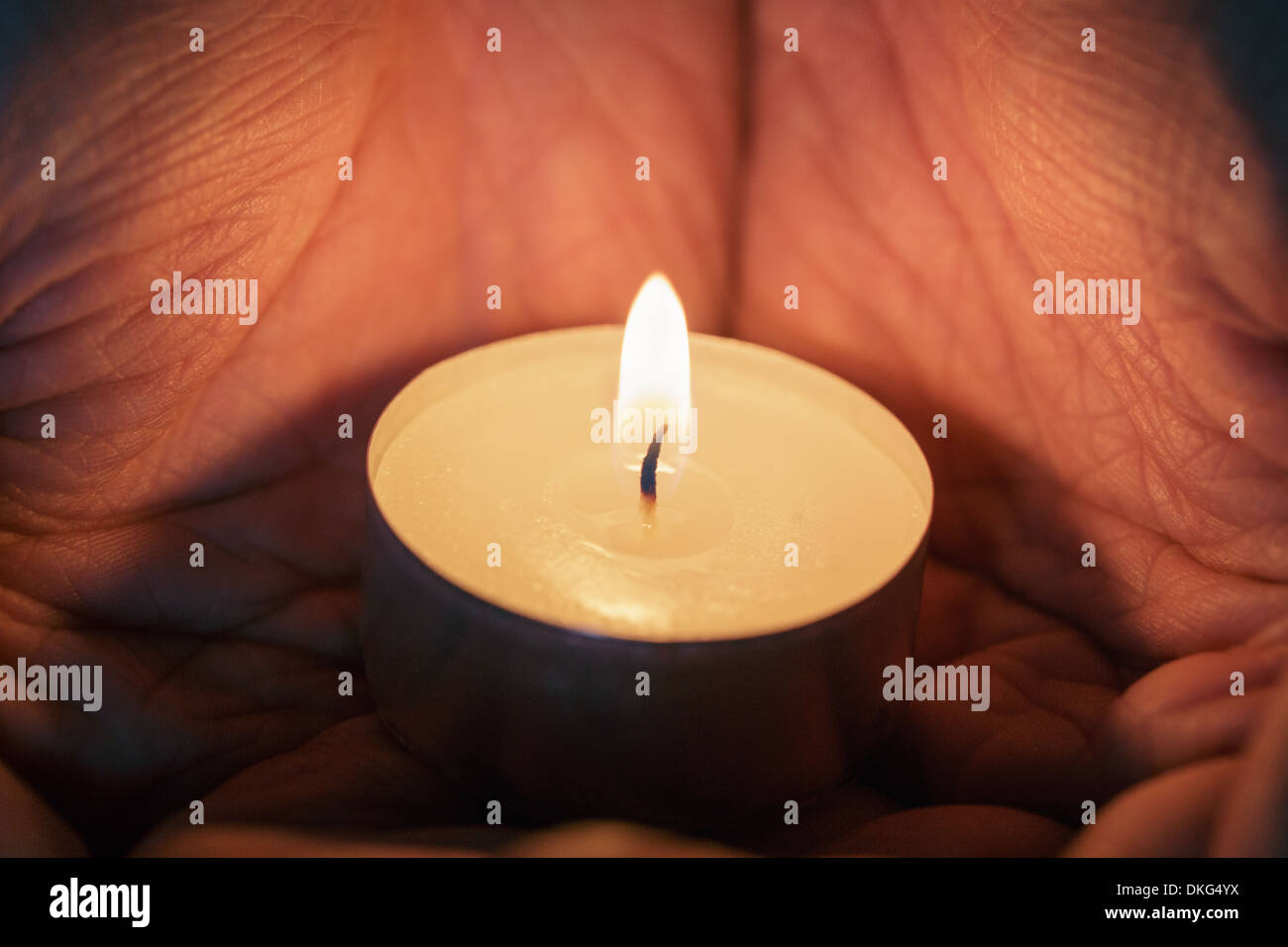 adult man hands holding burning candle hands holding burning candle in ...